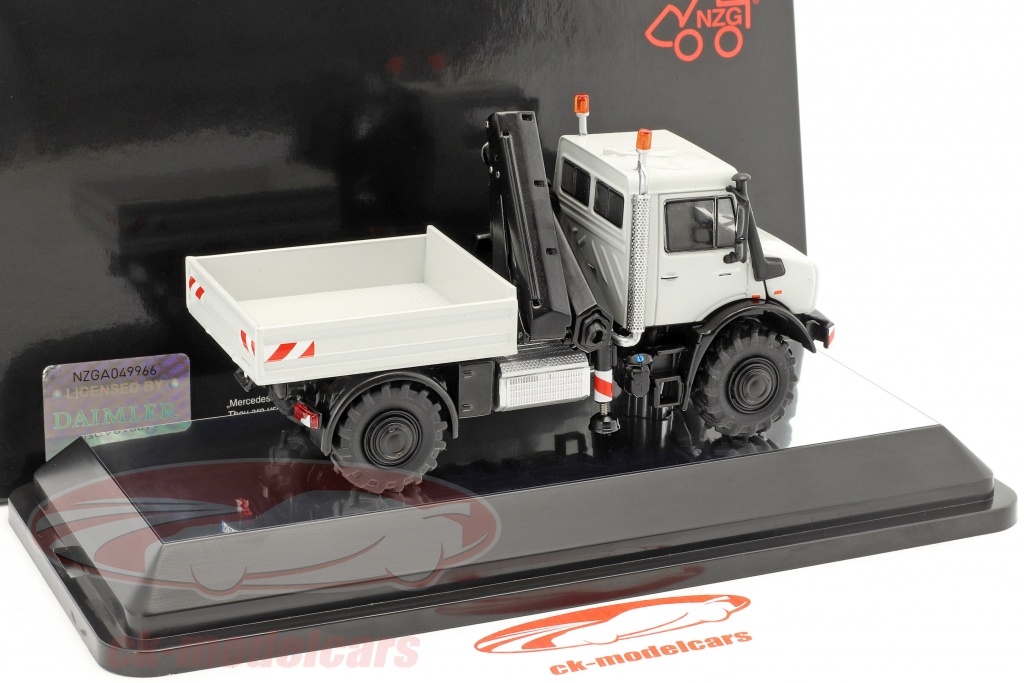 NZG 1:50 Mercedes-Benz Unimog U 5000 camión plataforma con grúa gris ...